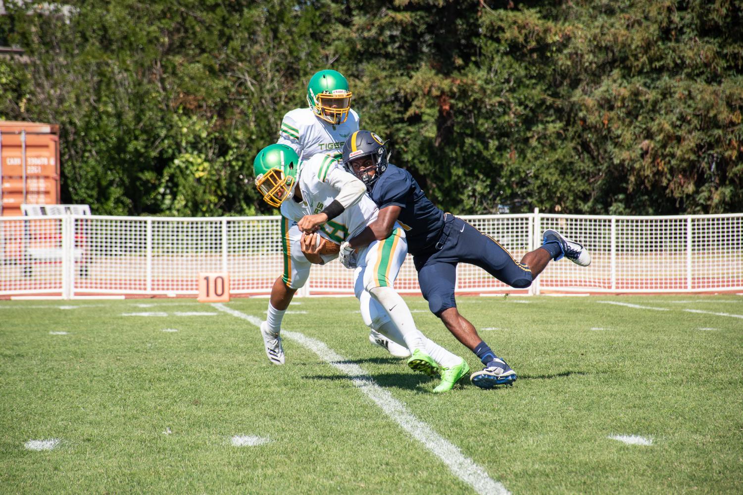 Varsity Football’s First Game Finishes in a Blowout – The Coat of Arms